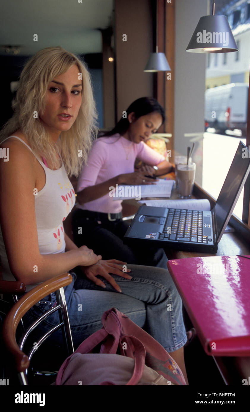 Students studying in coffee bar Stock Photo - Alamy