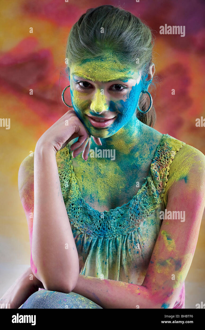Woman covered in holi colours Stock Photo - Alamy
