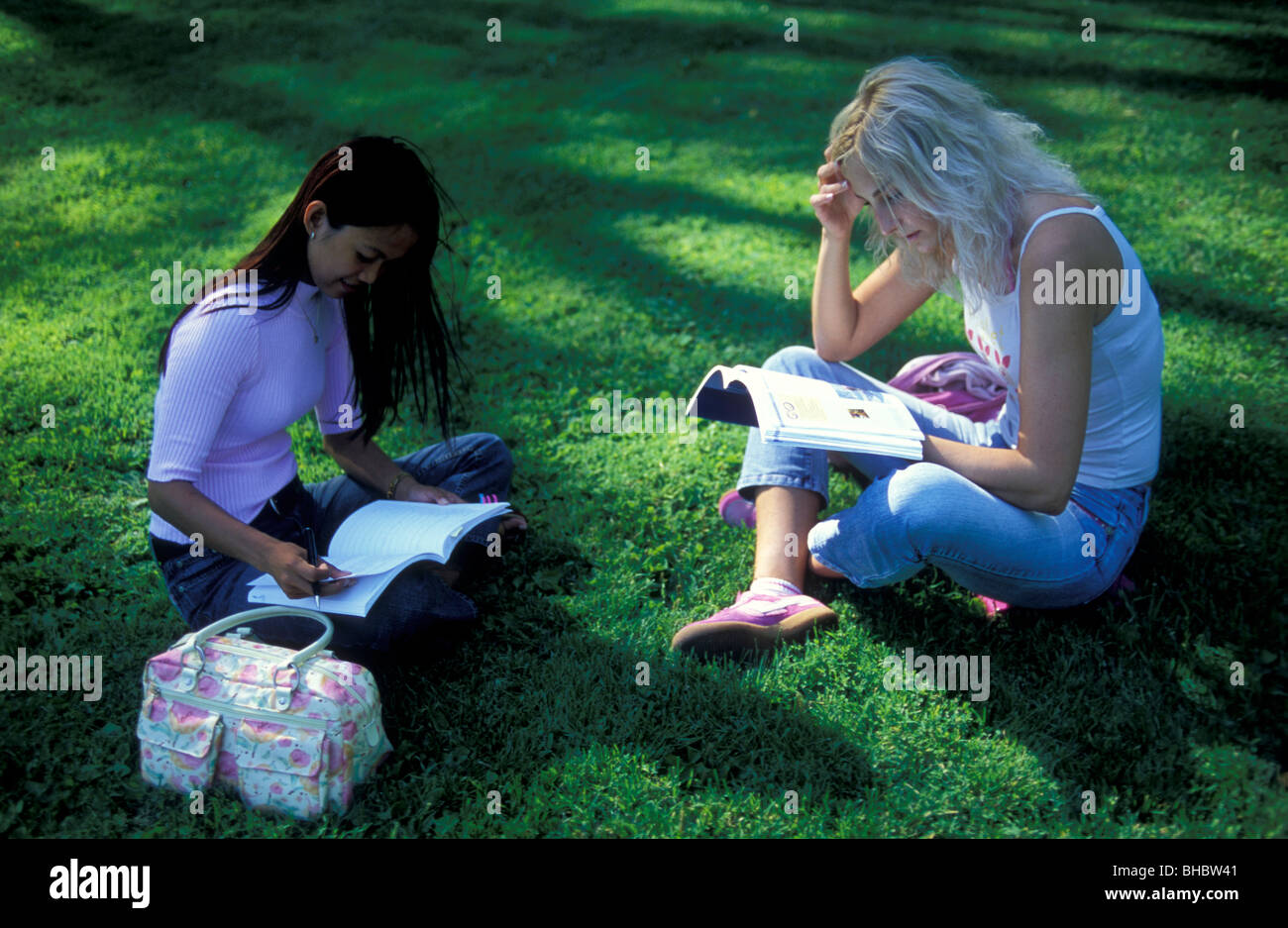 Two Girls Study In The Nature Stock Photo - Alamy