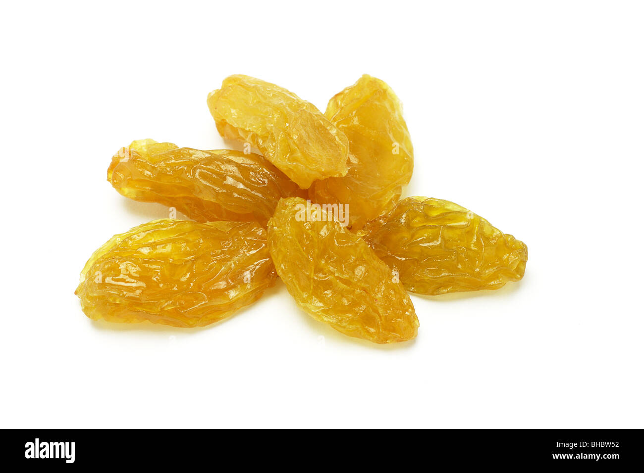 Golden jumbo size raisins on white background Stock Photo - Alamy