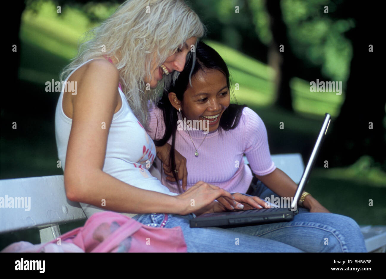 Two Girls Study In The Nature Stock Photo - Alamy