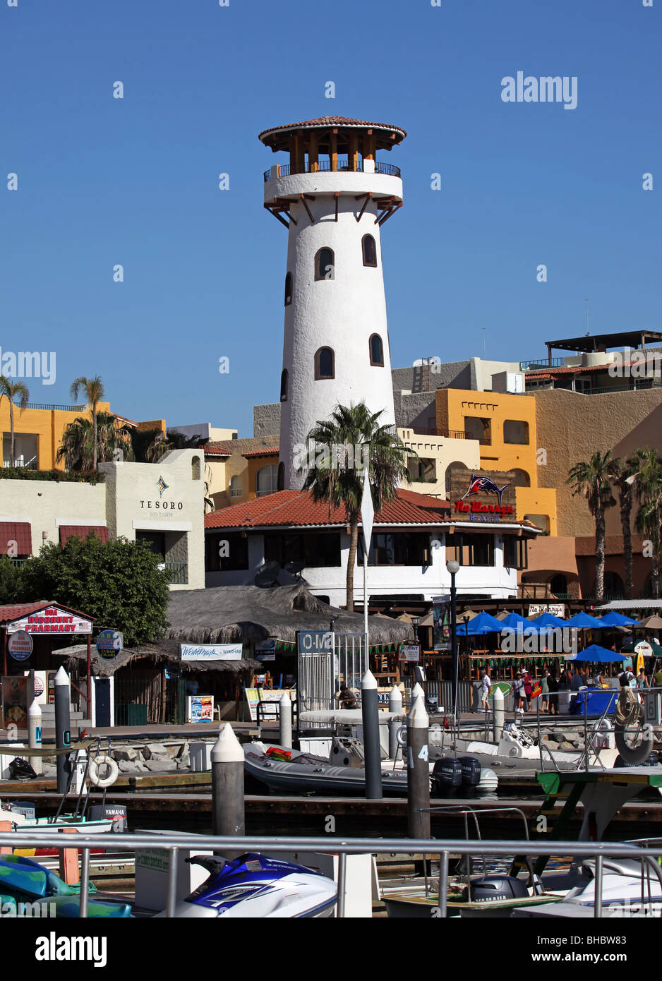 Cabo San Lucas marine harbor with boats and lighthouse. Mexican resort ...