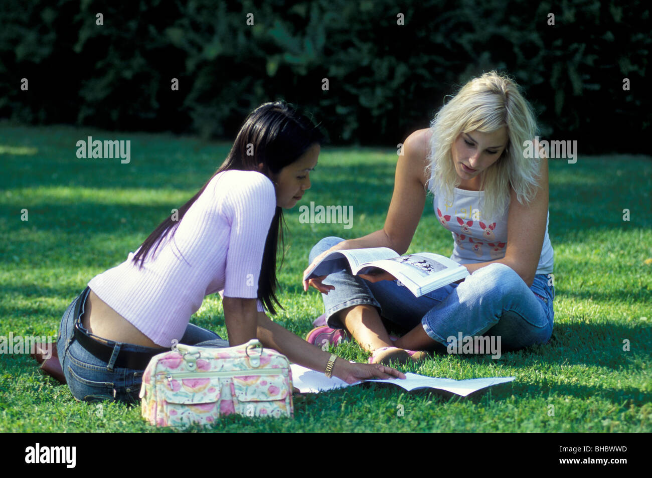 Two Girls Study In The Nature Stock Photo - Alamy