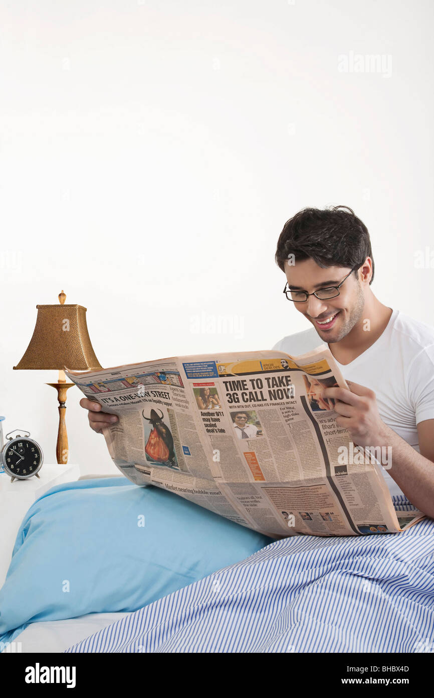 Man reading a newspaper Stock Photo - Alamy