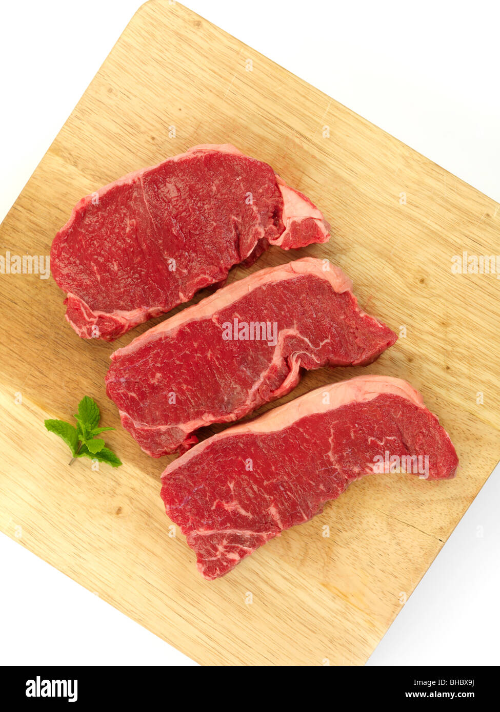 Porterhouse steak on a chopping board isolated against a white ...