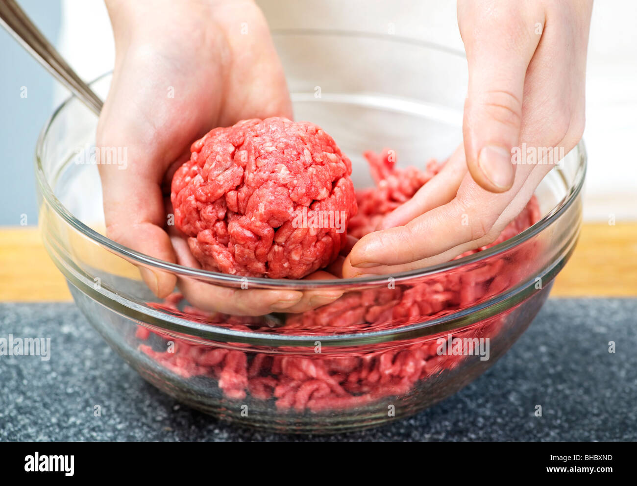 Chef making hamburgers in kitchen with ground beef Stock Photo - Alamy