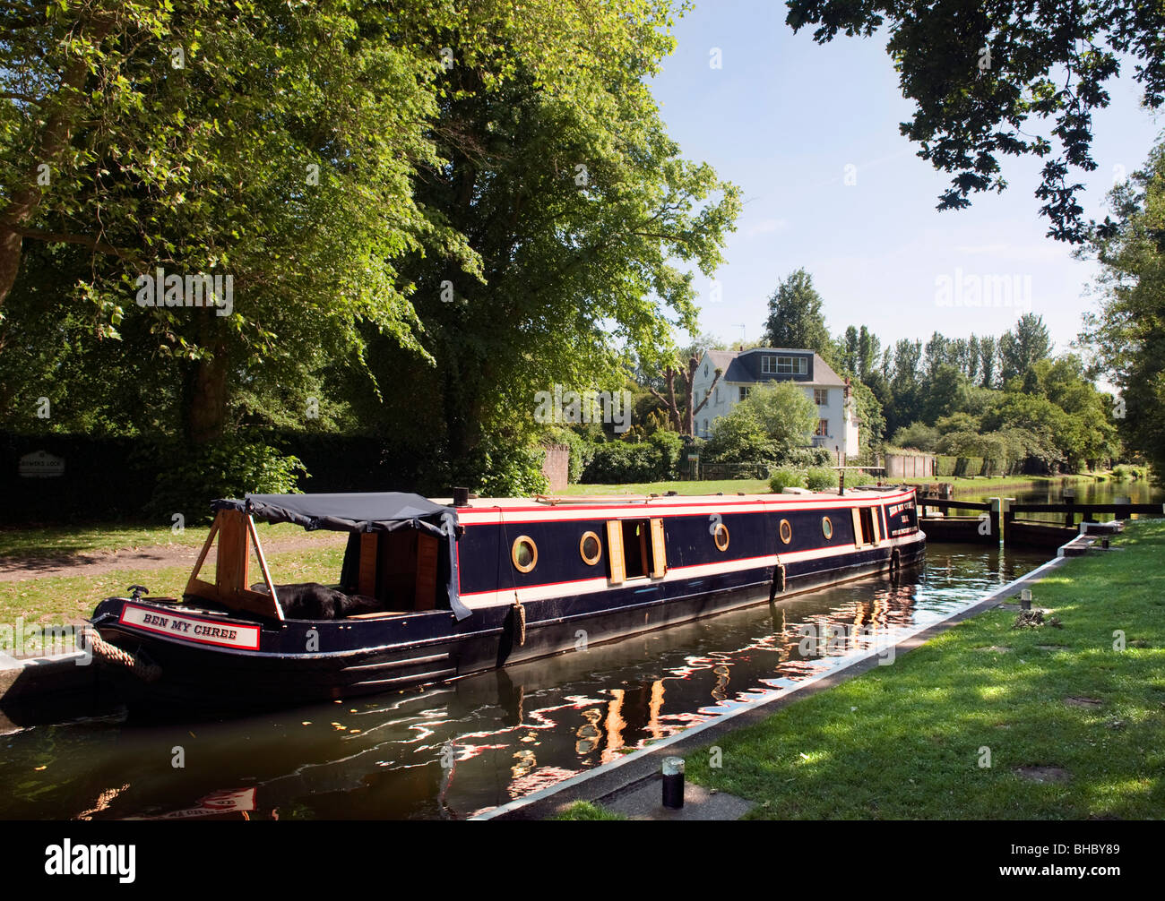 A narrowboat at Bowers lock near to the and former mill house, River ...