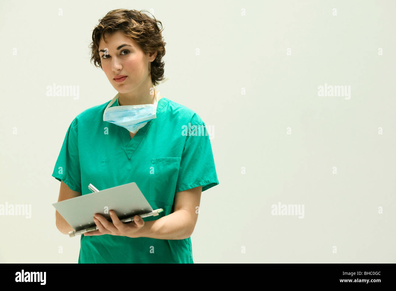 Female doctor taking notes Stock Photo - Alamy