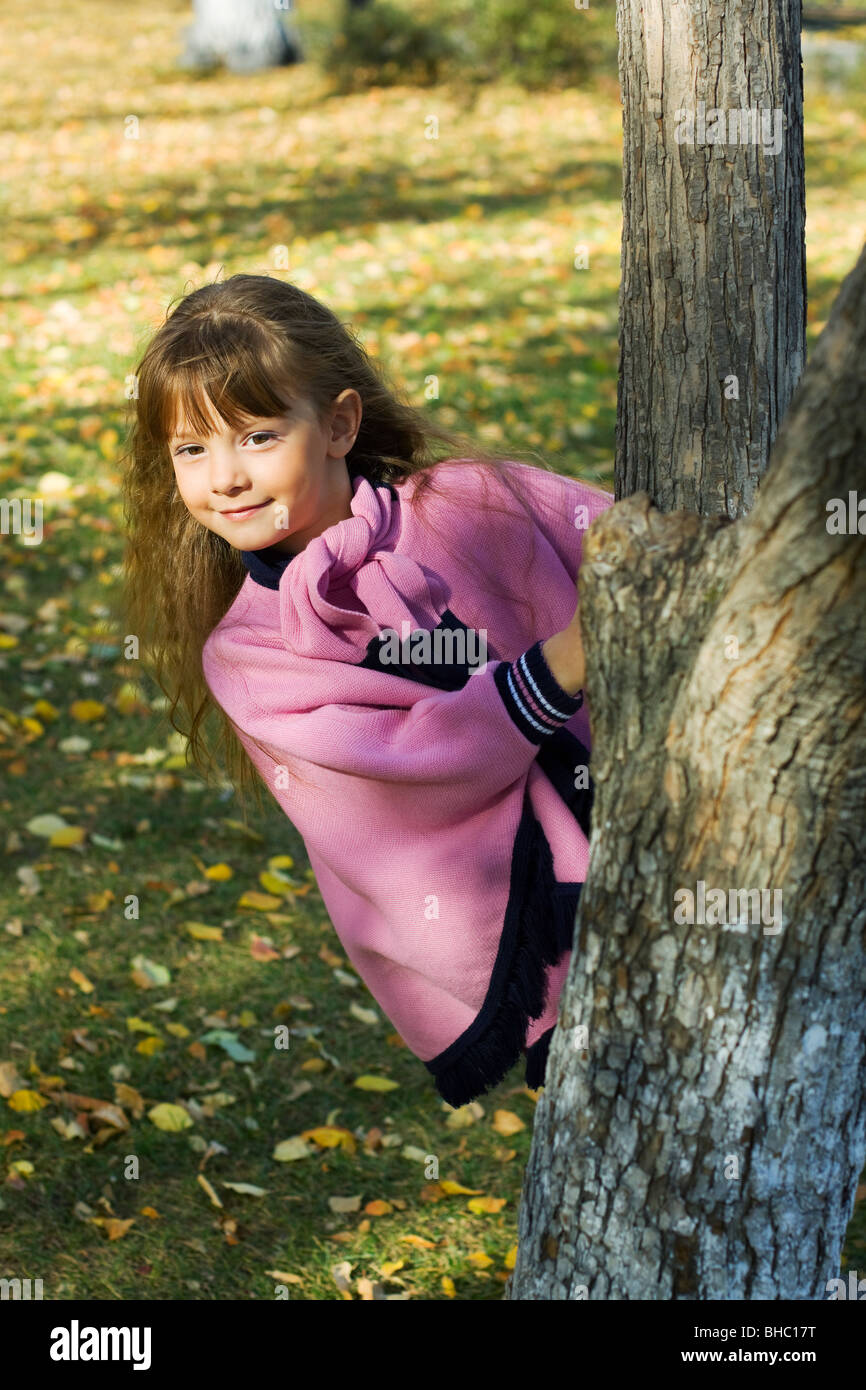 Happy little girl playing in the park Stock Photo - Alamy