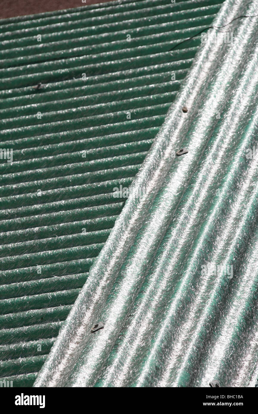 asbestos type sheets on property roof in sun Stock Photo - Alamy