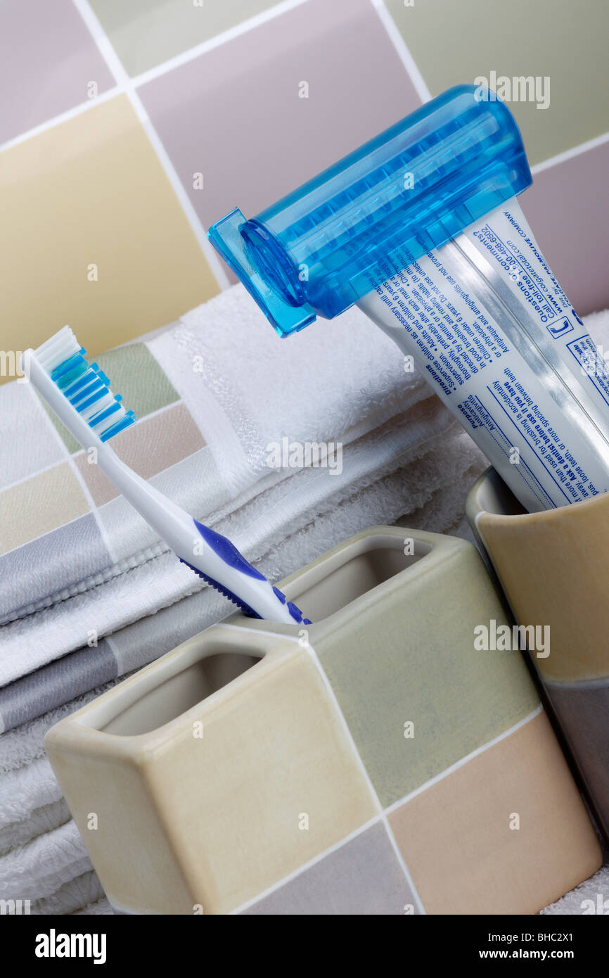 Toothpaste tooth paste tube with squeezer dispenser a toothbrush ...