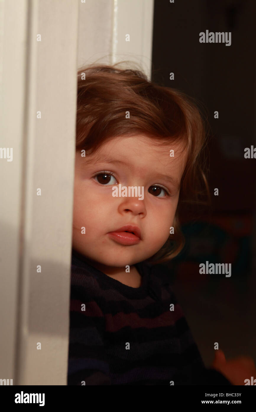 Person observing by the door hi-res stock photography and images - Alamy