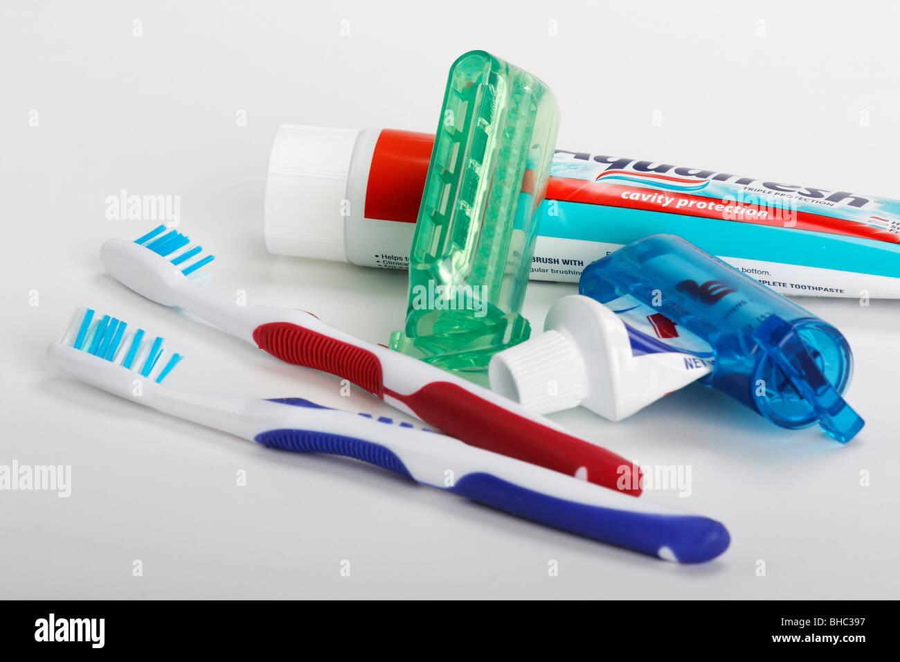 Toothpaste tooth paste tube with squeezer dispenser a toothbrush ...