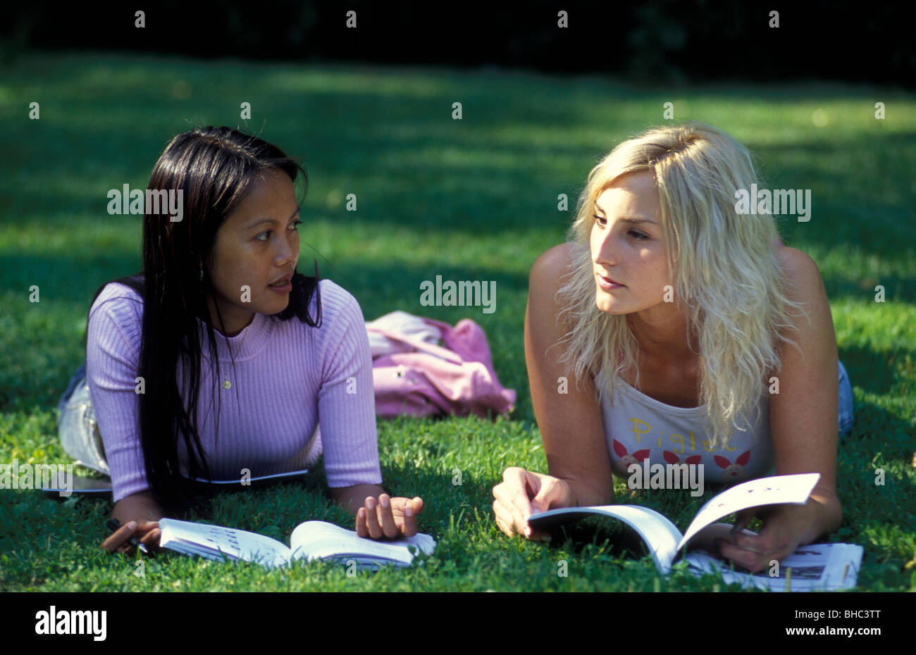 Two Girls Study In The Nature Stock Photo - Alamy