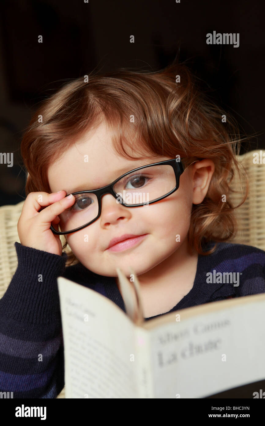A twenty months old baby girl meaning that she reads for real with fake ...