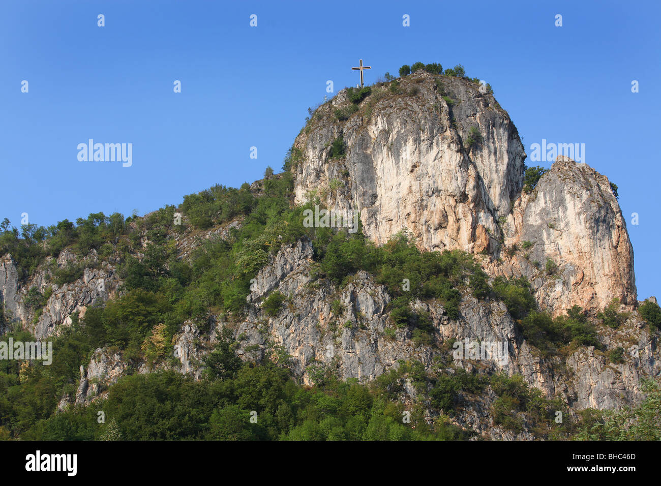 golden cross on the cliff Stock Photo - Alamy