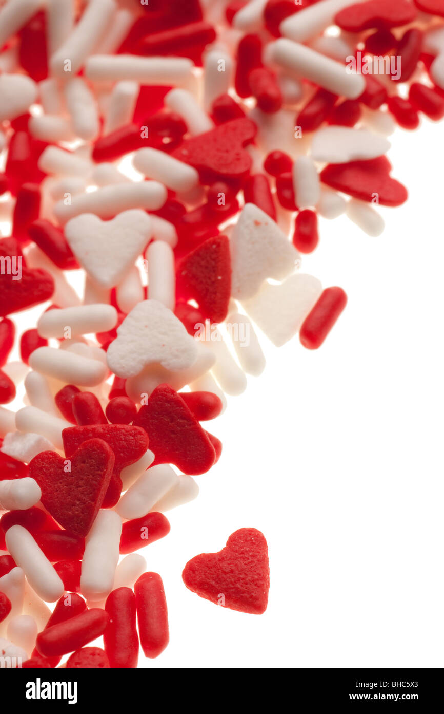 Valentine heart sprinkles isolated on white background Stock Photo - Alamy