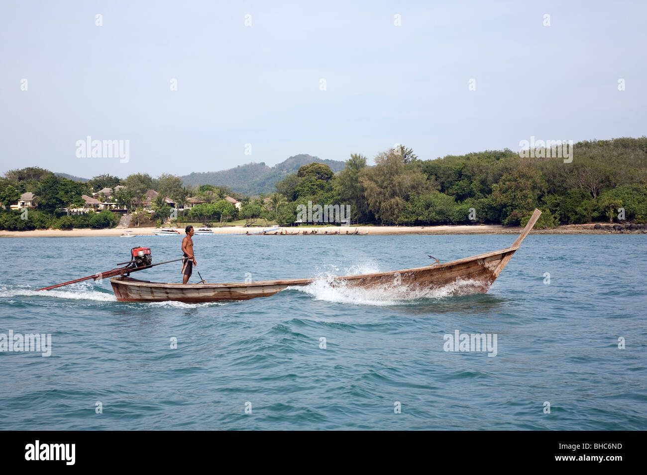 Man sailing in Long Boat Stock Photo - Alamy
