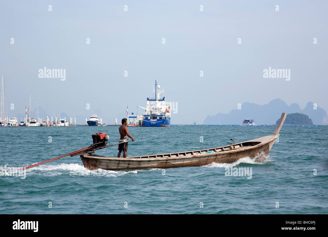 Man sailing in Long Boat Stock Photo - Alamy