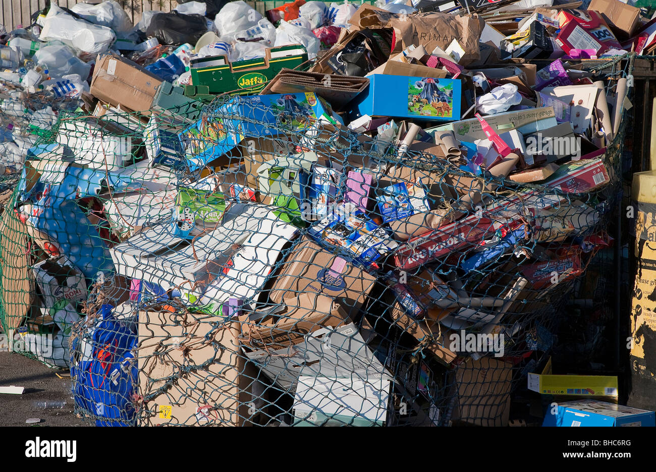 Close-up of cardboard waste in plastic net at recycling collection ...