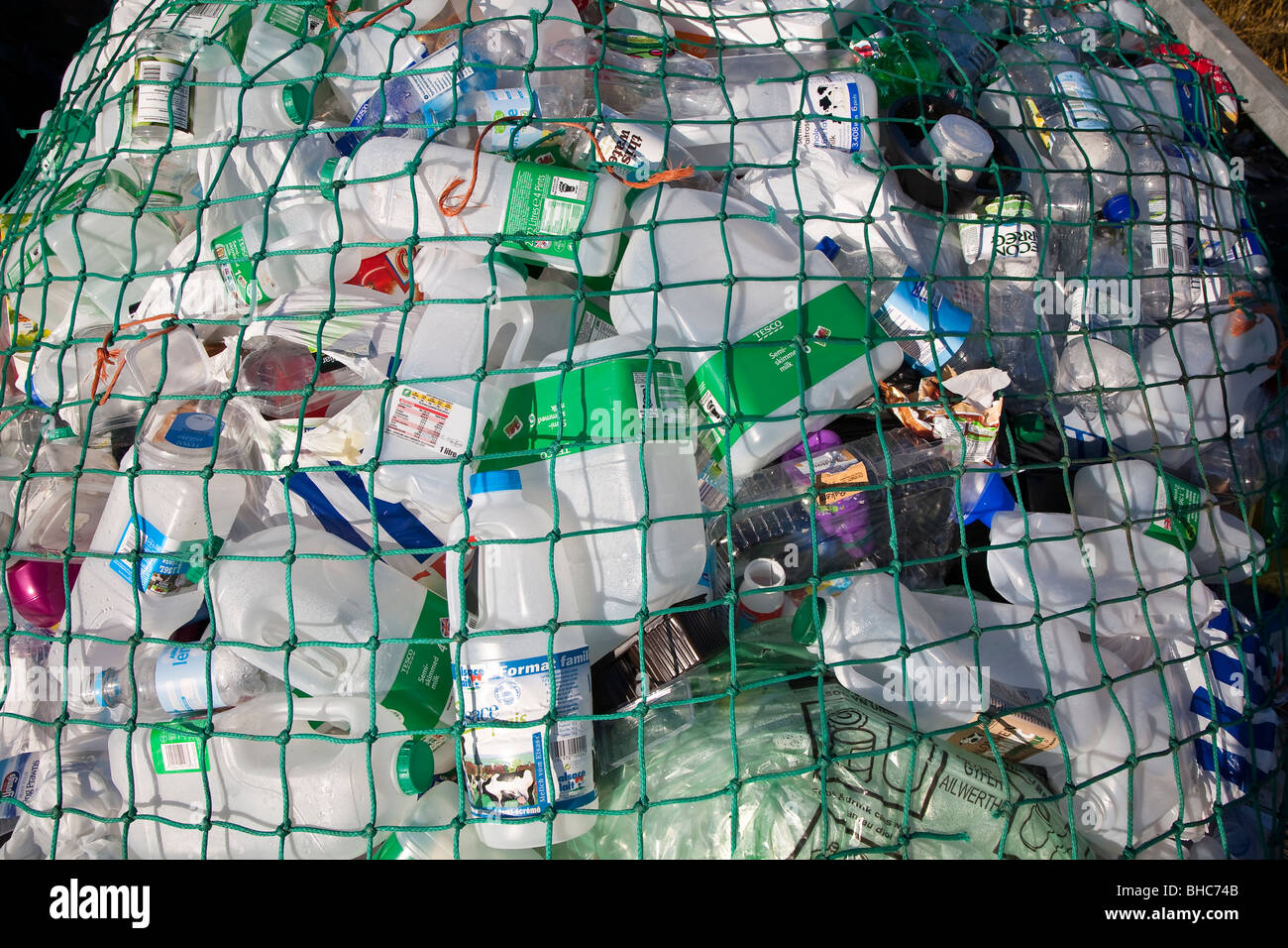 Plastic waste for recycling at recycling collection station in car park ...