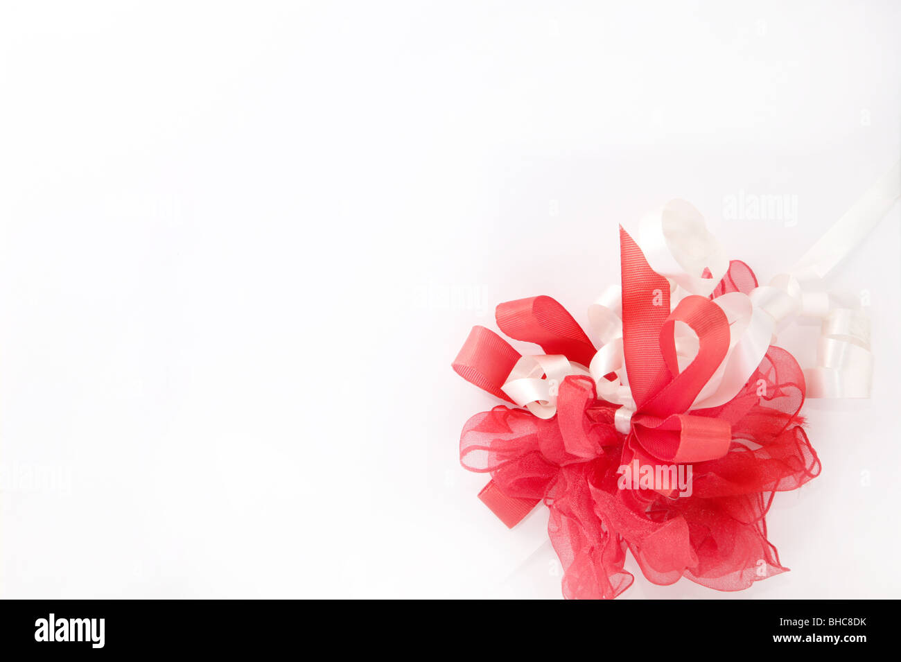 Red Gift looping right side on a white background Stock Photo - Alamy