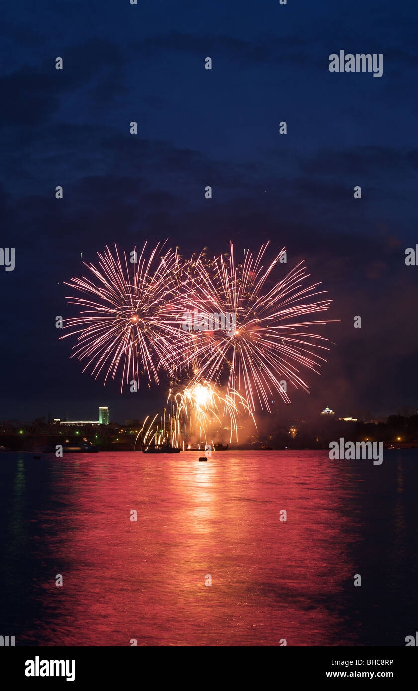 Spectacular display of firework over water Stock Photo - Alamy