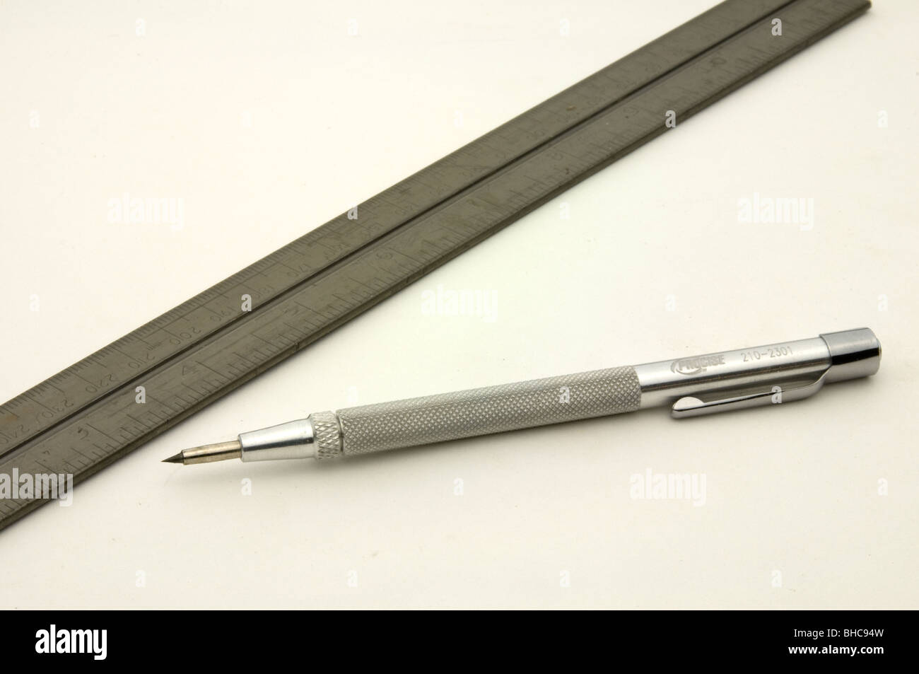Metal scriber and ruler in isolation on a white background Stock Photo ...