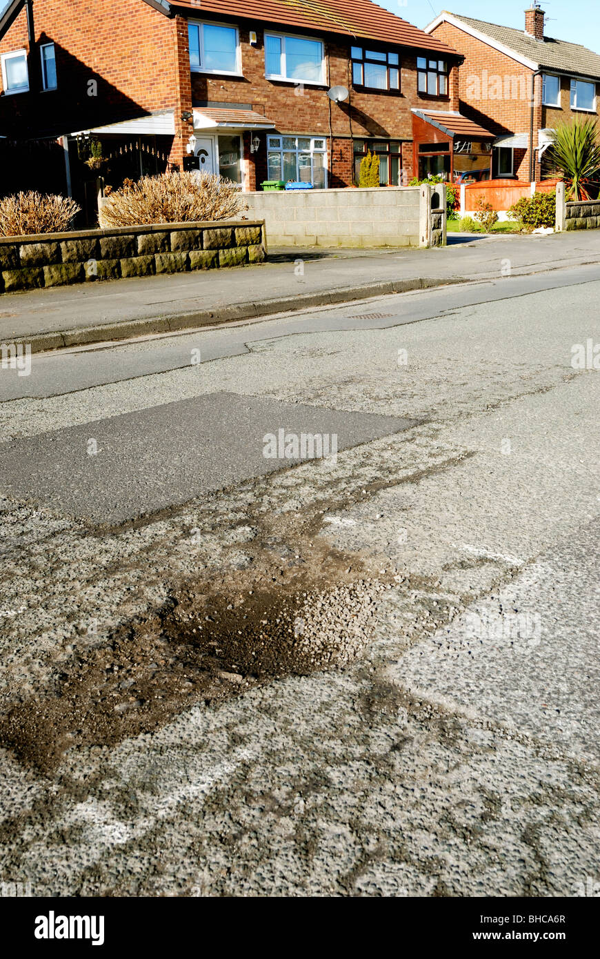 Pothole in road surface on road in Cheshire, UK Stock Photo - Alamy
