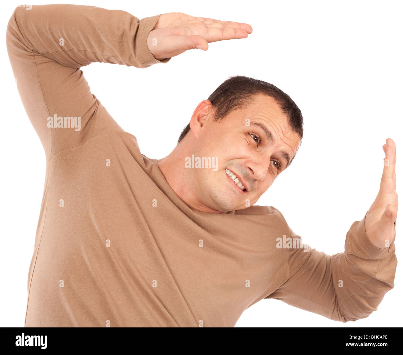 Man pushing to the sides of the image as if he is in a box Stock Photo ...