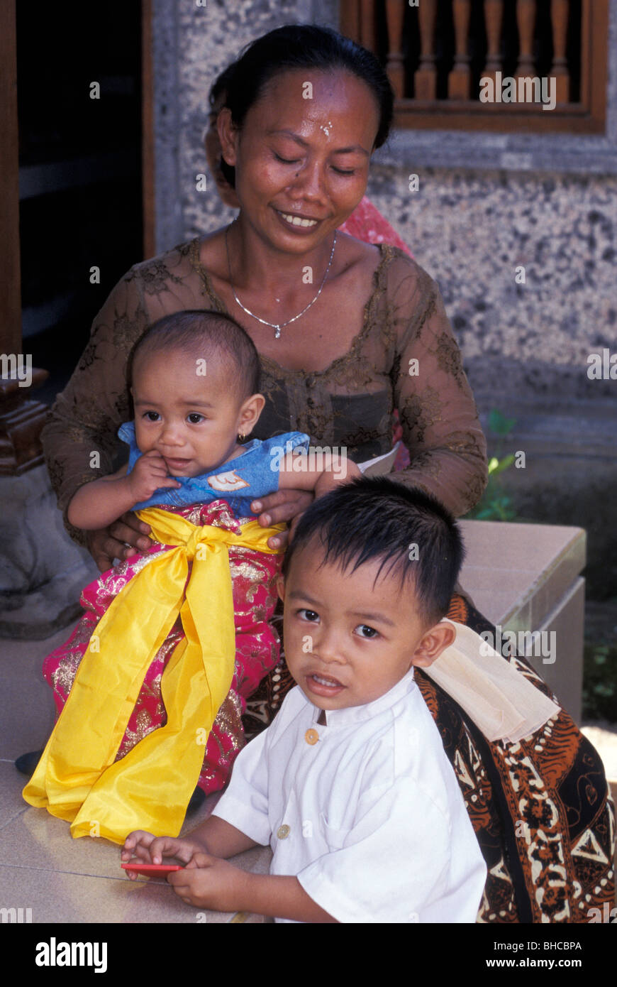 Balinese Woman with Children Stock Photo - Alamy