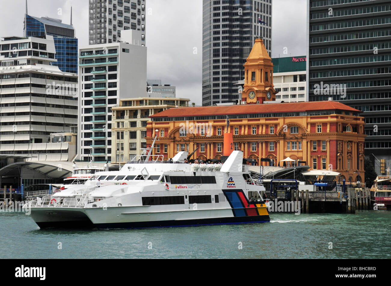Catamaran leaving the Old Ferry Building at Auckland Harbour, New ...