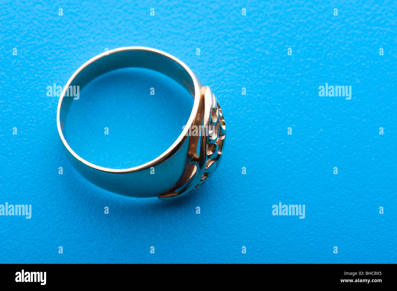 object on blue - Gold rings close up Stock Photo - Alamy