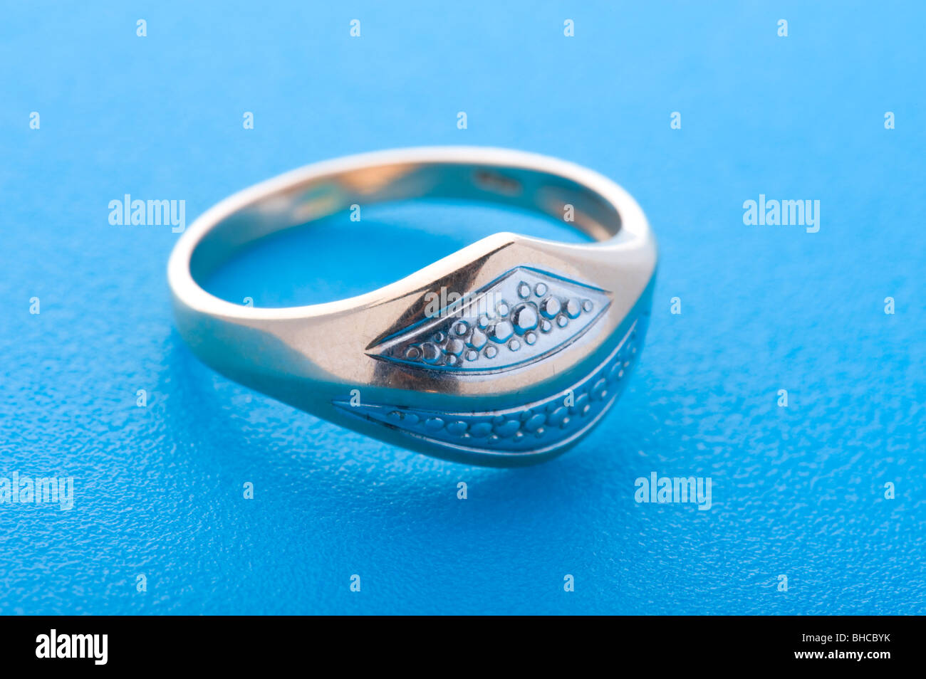 object on blue - Gold rings close up Stock Photo - Alamy
