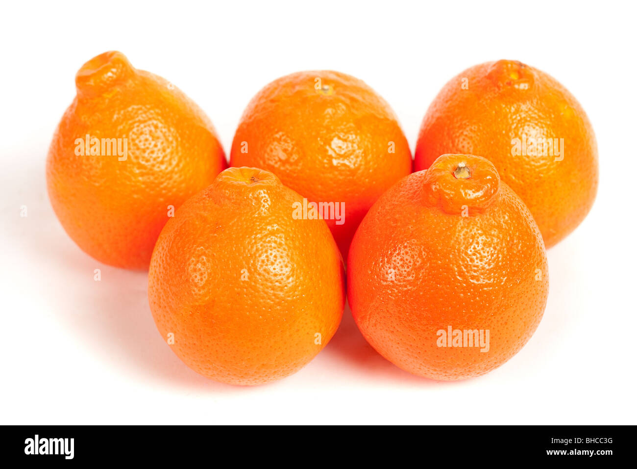 Very detailed image of a group of ripe oranges isolated on white ...