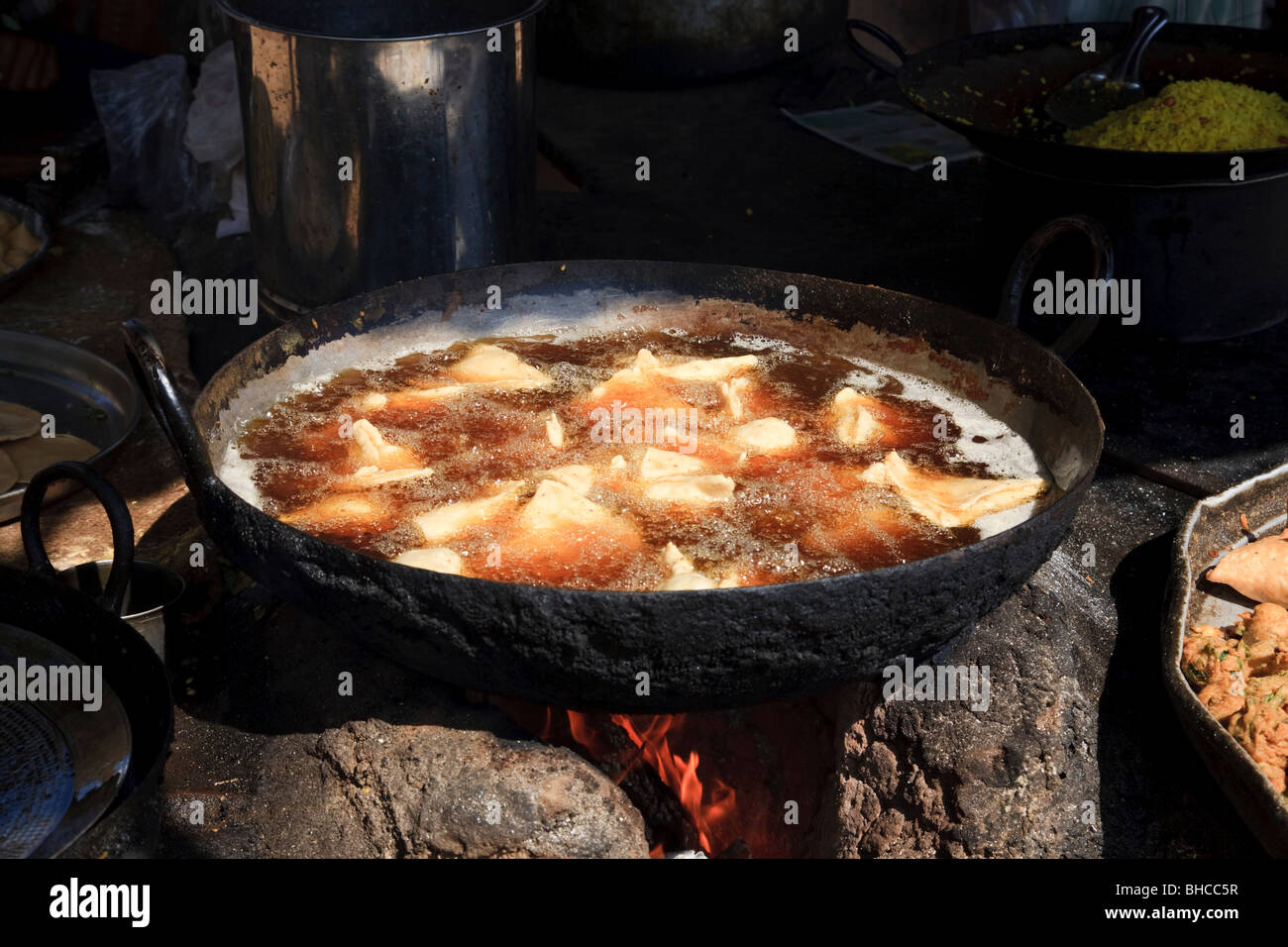 A street vendor frying Samosas in India Stock Photo - Alamy