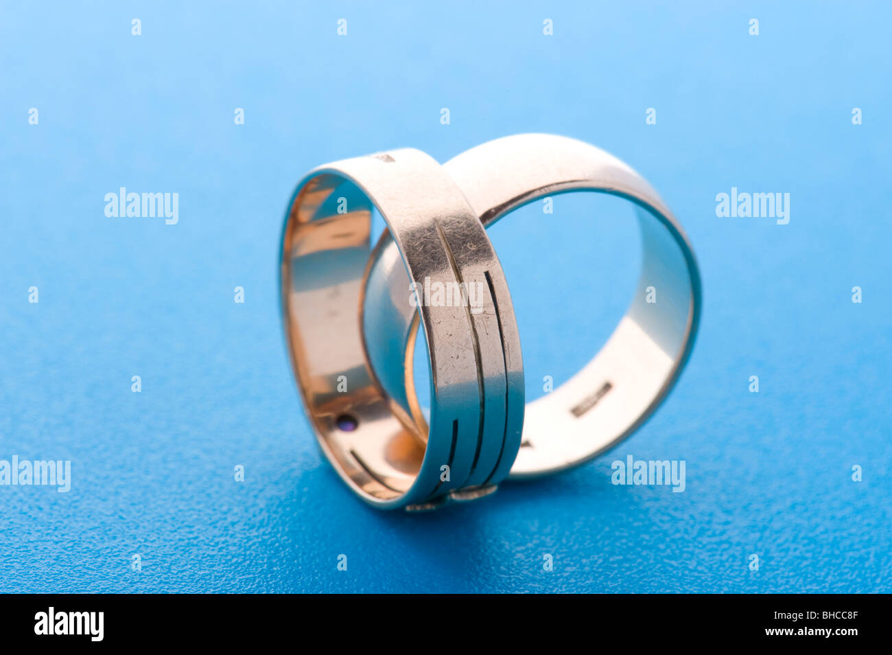 object on blue - Gold rings close up Stock Photo - Alamy