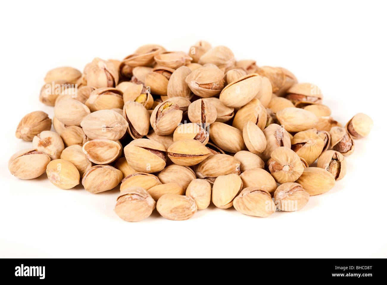 Close up of salted roast pistachio isolated on white background Stock Photo - Alamy