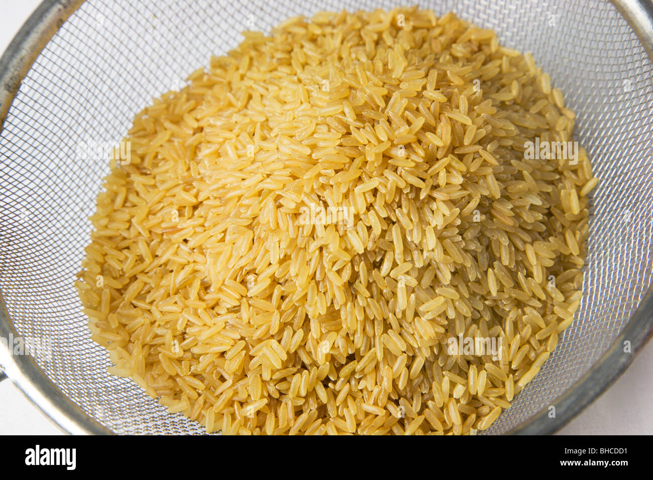Brown Rice in a Sieve Stock Photo - Alamy