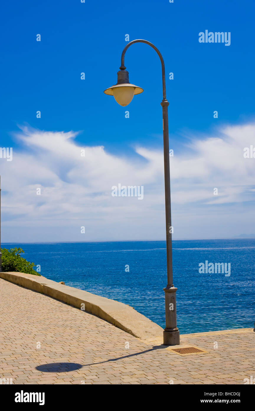 Lamp post against blue sky Stock Photo - Alamy