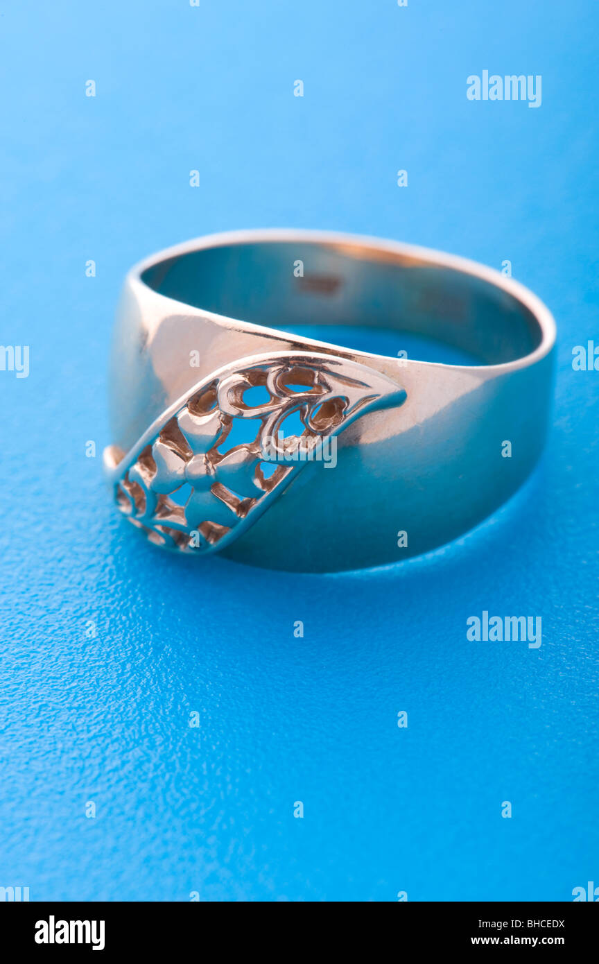 object on blue - Gold rings close up Stock Photo - Alamy