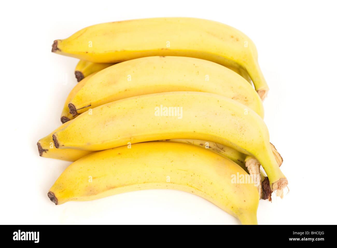 Detailed close up of a bunch of ripe bananas, isolated on white ...