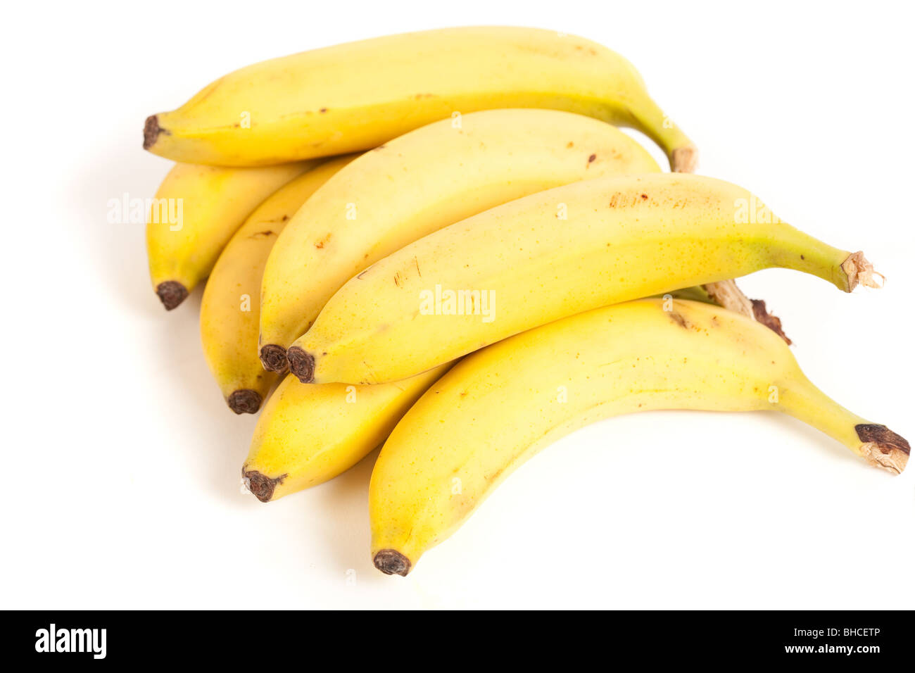 Detailed close up of a bunch of ripe bananas, isolated on white ...