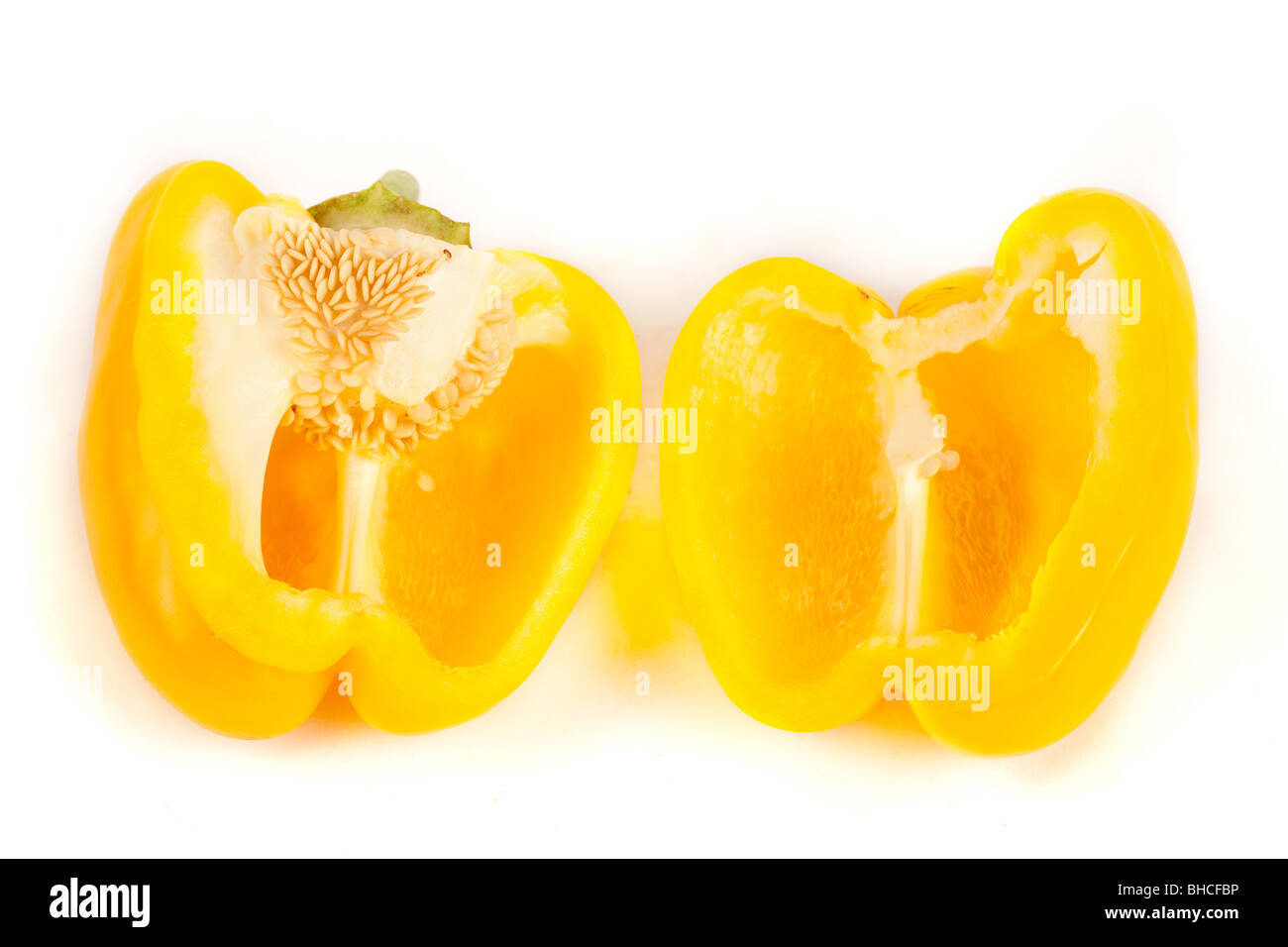 Close up of a sliced yellow pepper isolated on white background Stock ...