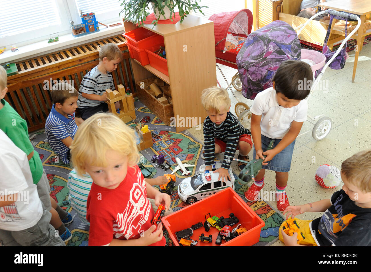 Preschool children playing in class with toys Stock Photo - Alamy