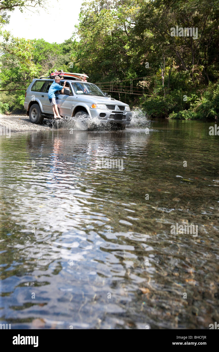 4x4 car driving through river hi-res stock photography and images - Alamy