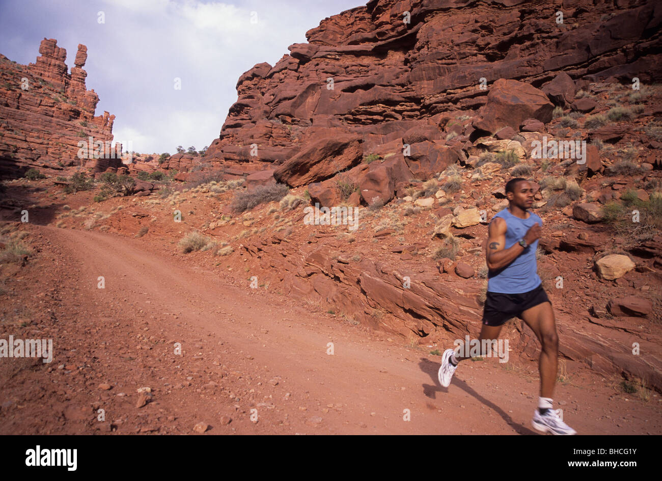 Man running in desert Stock Photo - Alamy
