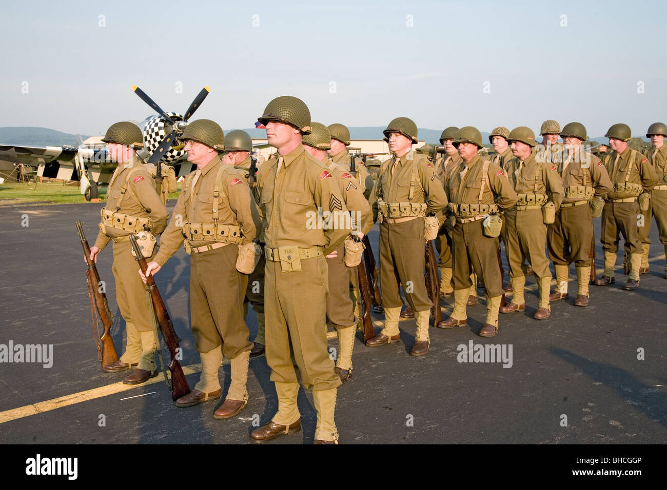 World War II Infantry troops standing at attention with sunset light on ...