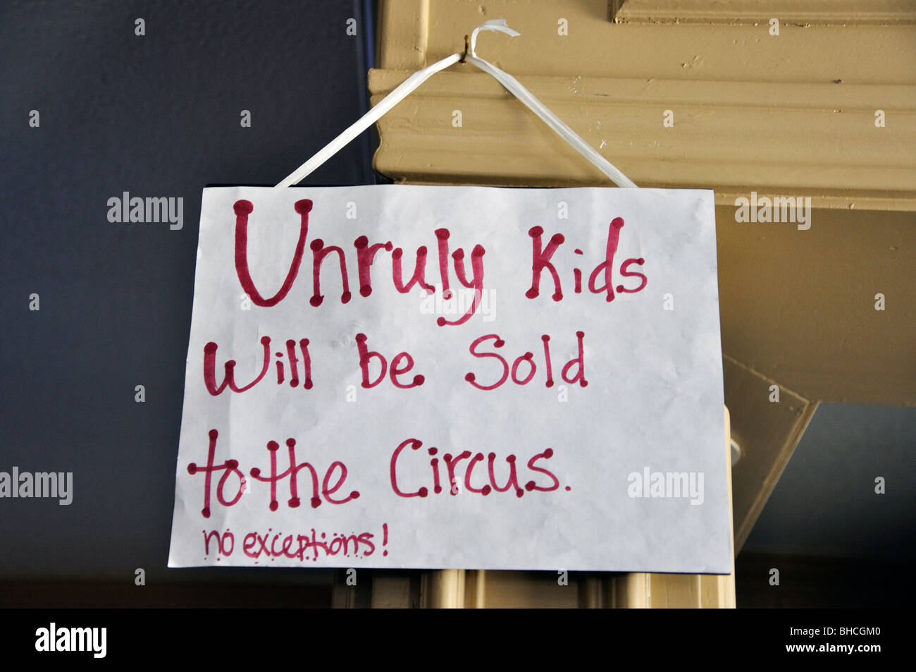 Unruly Kids sign in museum Stock Photo - Alamy