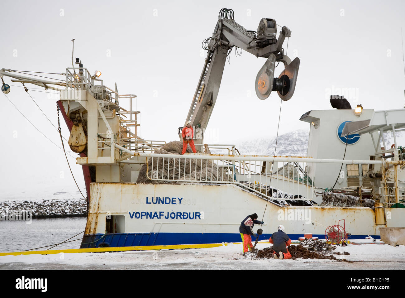 Fishermen on fishing boat Lundey. Vopnafjordur harbour, East Iceland ...